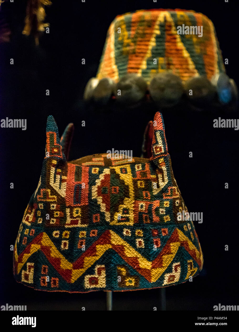 Colourful truncated conical wool hats worn by Altiplano tribes, museum ...