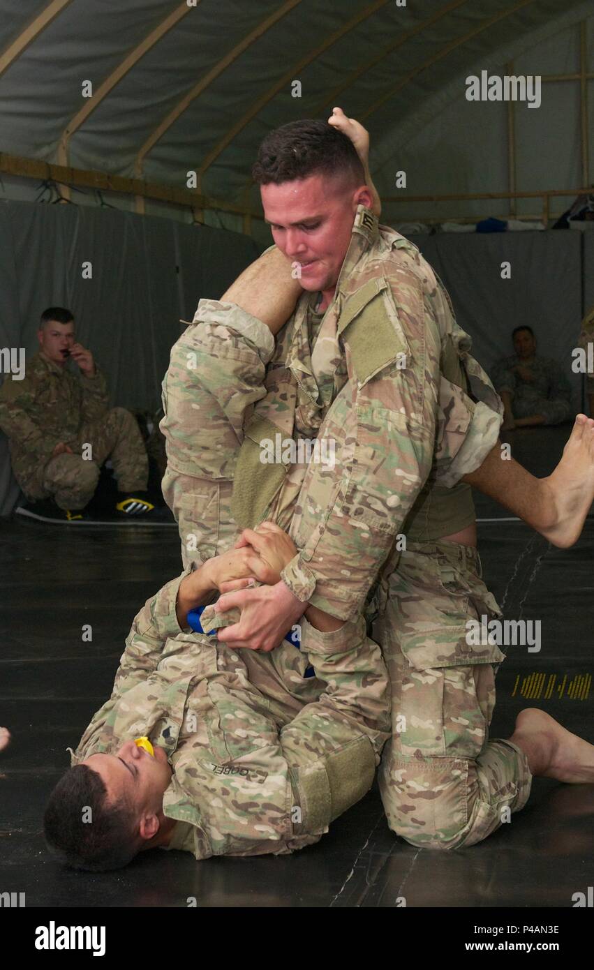 Competitors fight for position in a combatives tournament during the ...