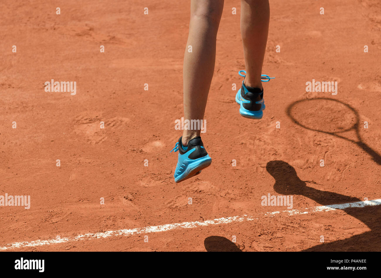 Feet of a female tennis player in jump after shot, service Stock Photo ...