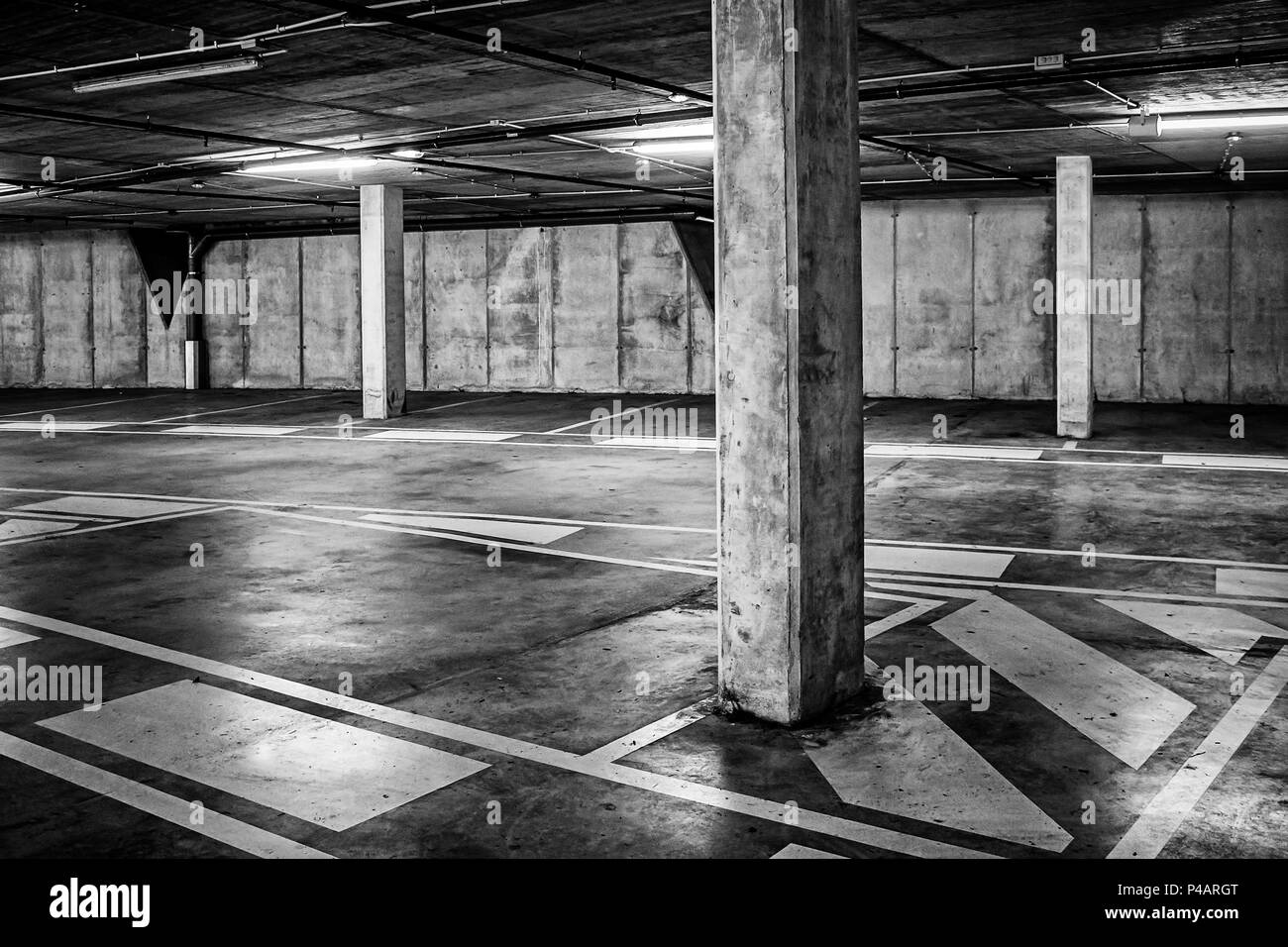Interior of an empty car park, detail of a place to leave cars ...
