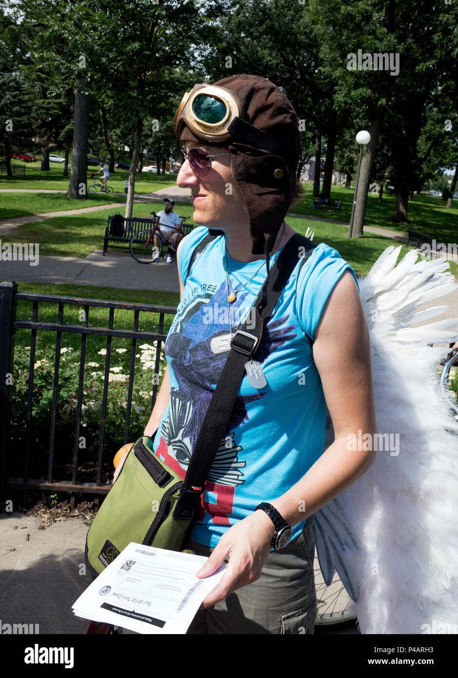 Tour de Fat director wearing goggled flight cap and white feathered ...
