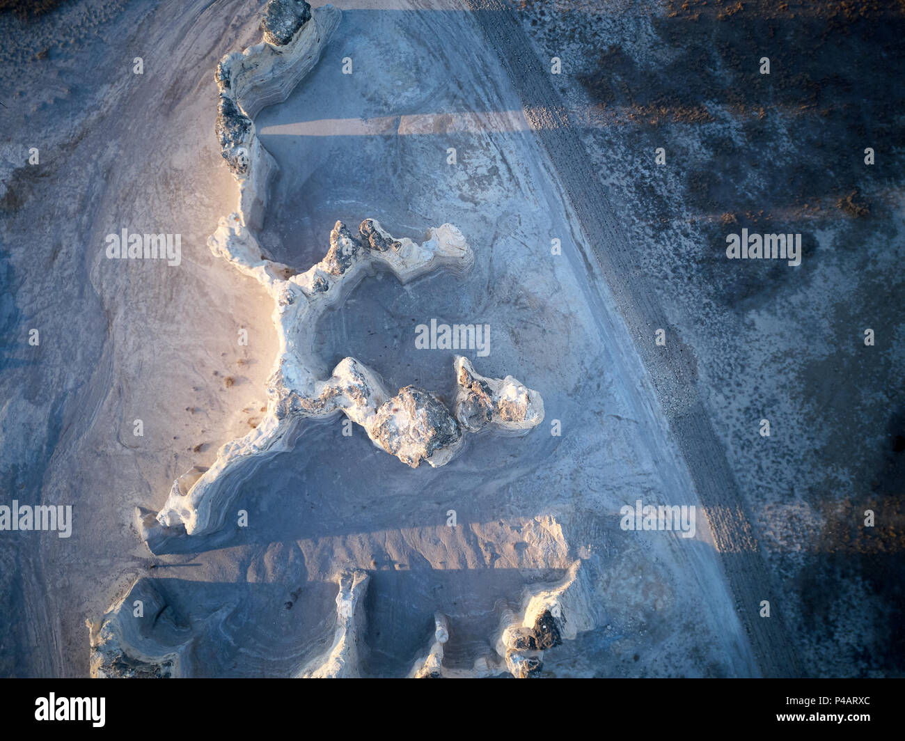 Aerial view of the chalk pyramids at Monument Rocks, Kansas showing the barren landscape and ...