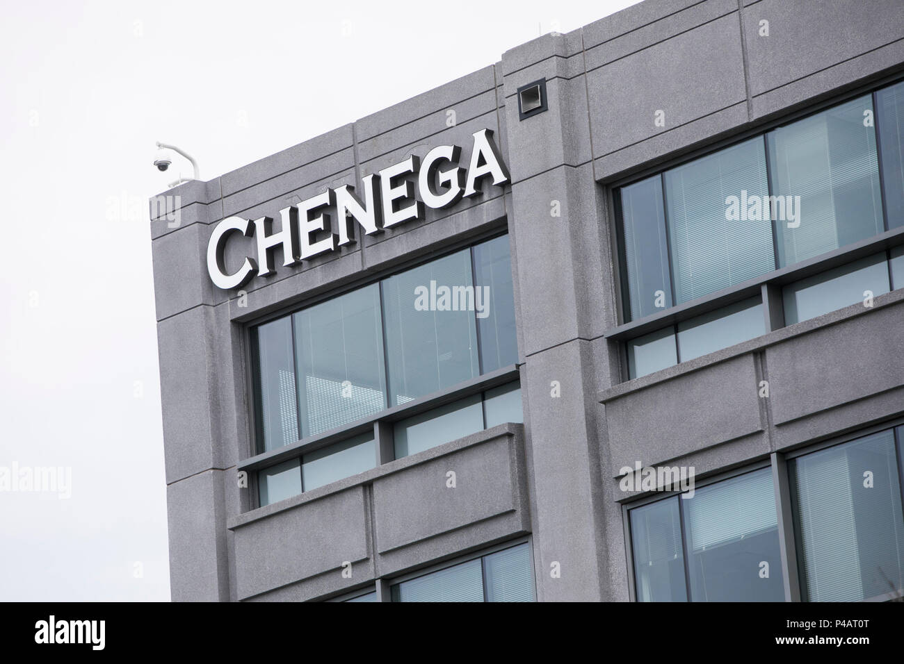 A logo sign outside of a facility occupied by the Chenega Corporation ...