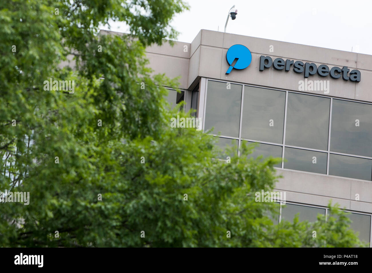A logo sign outside of a facility occupied by Perspecta in Chantilly ...
