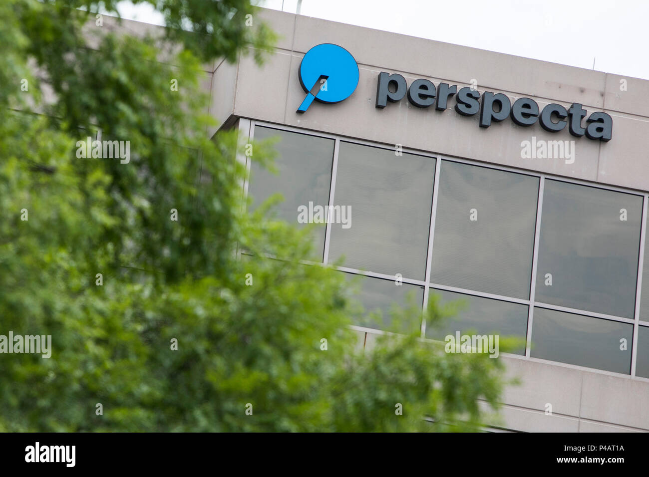 A logo sign outside of a facility occupied by Perspecta in Chantilly ...