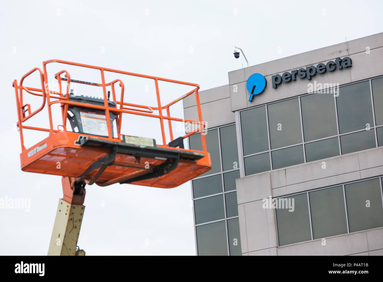 A logo sign outside of a facility occupied by Perspecta in Chantilly ...