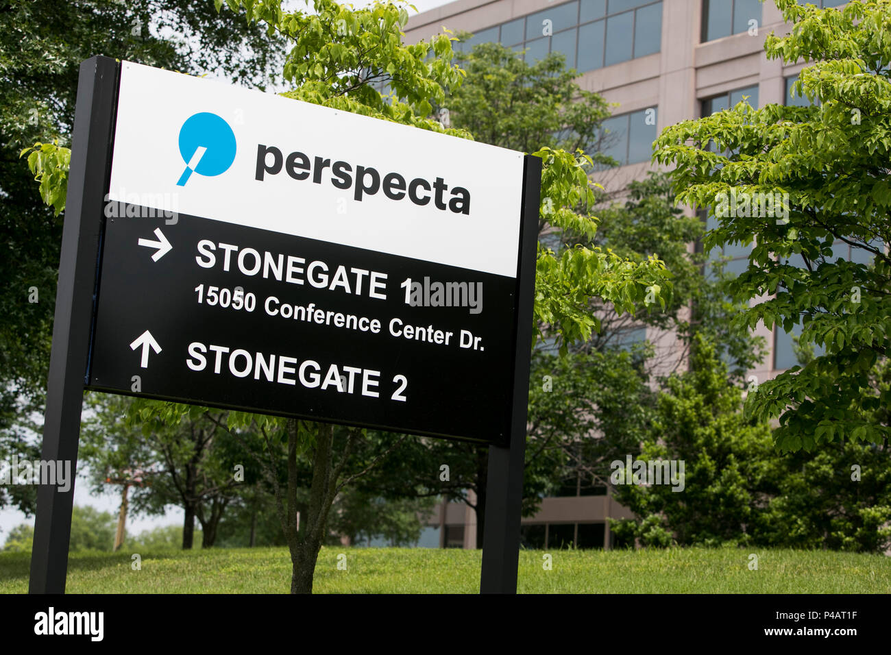 A logo sign outside of a facility occupied by Perspecta in Chantilly ...