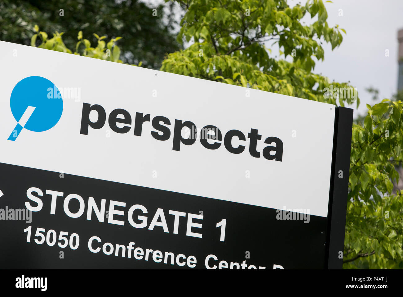 A logo sign outside of a facility occupied by Perspecta in Chantilly ...