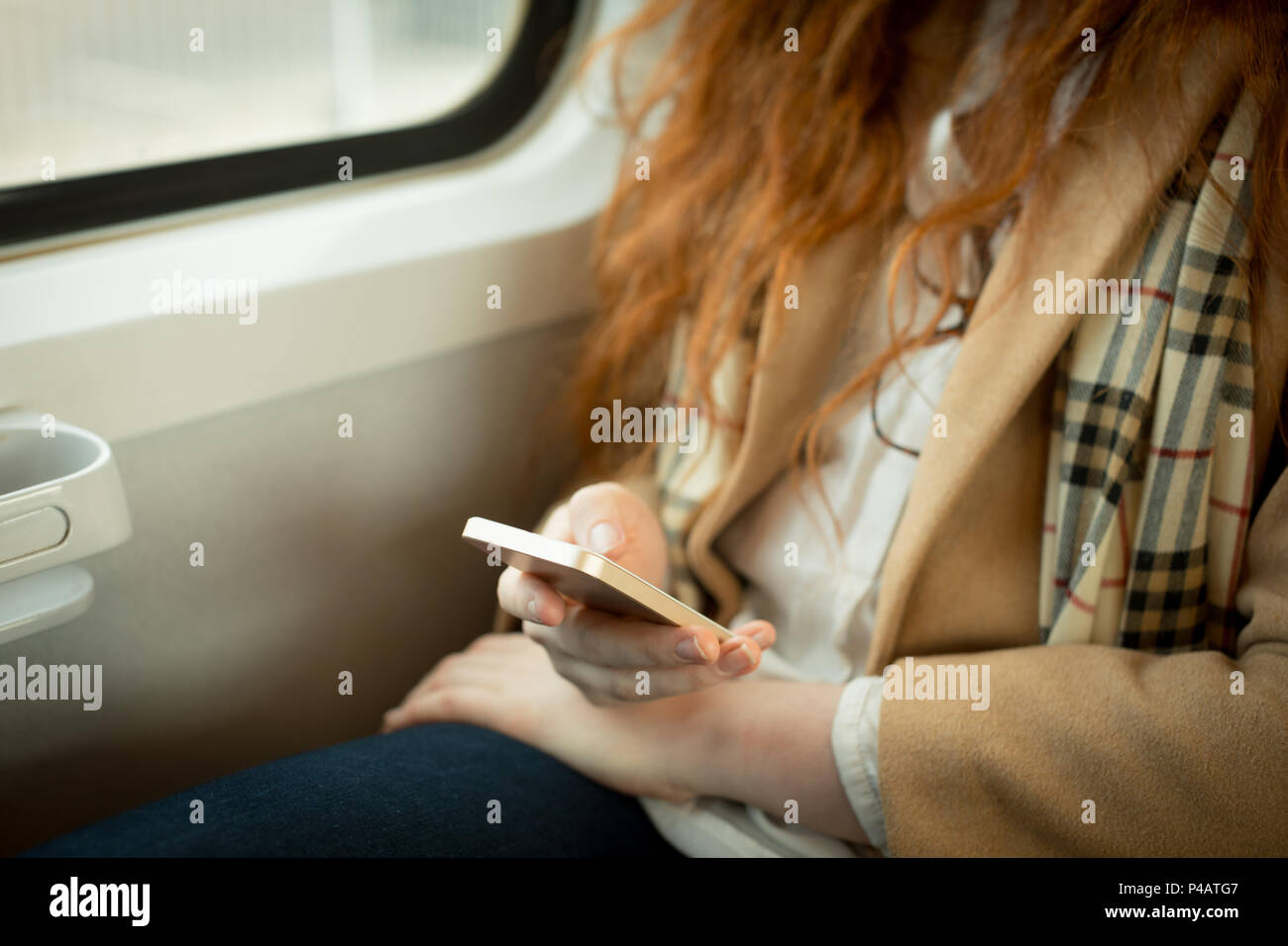 Girl mobile on train hi-res stock photography and images - Alamy