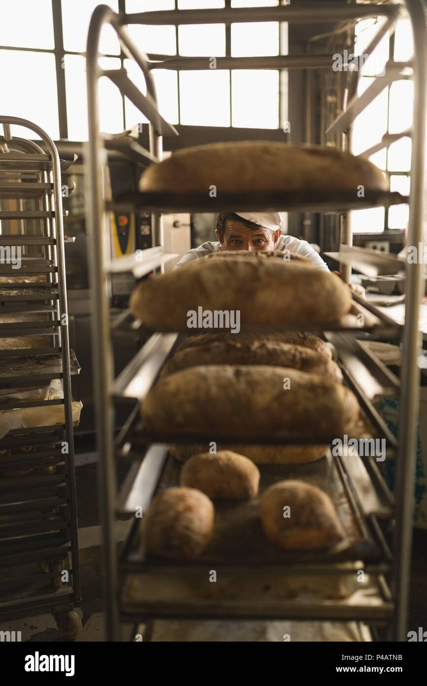 Male baker checking baked hi-res stock photography and images - Alamy