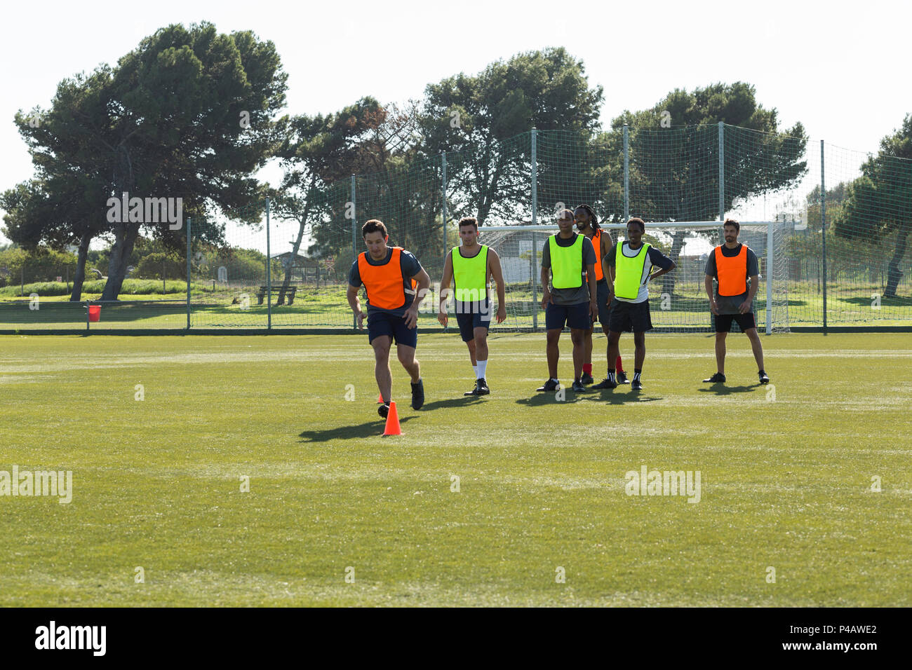 Soccer player dribbling through cones hi-res stock photography and ...