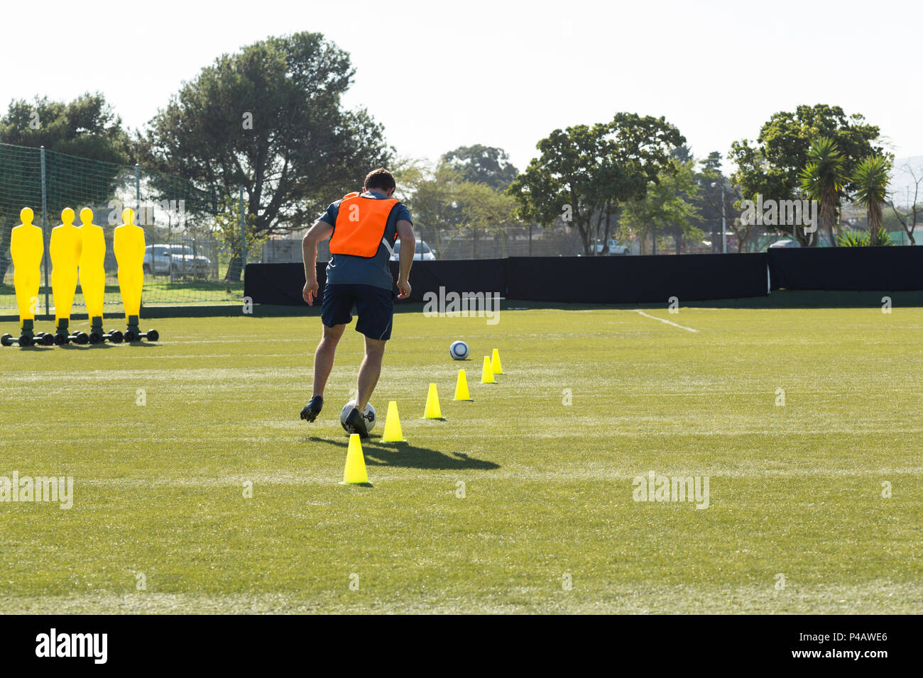 Soccer player dribbling through cones hi-res stock photography and ...