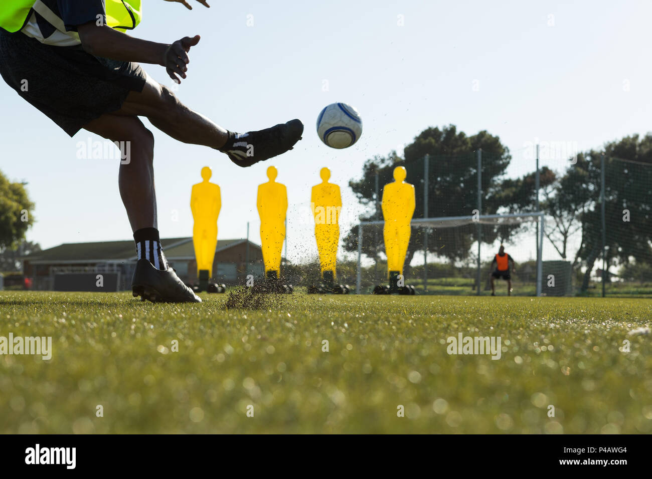 Kicking soccer ball player in hi-res stock photography and images - Alamy