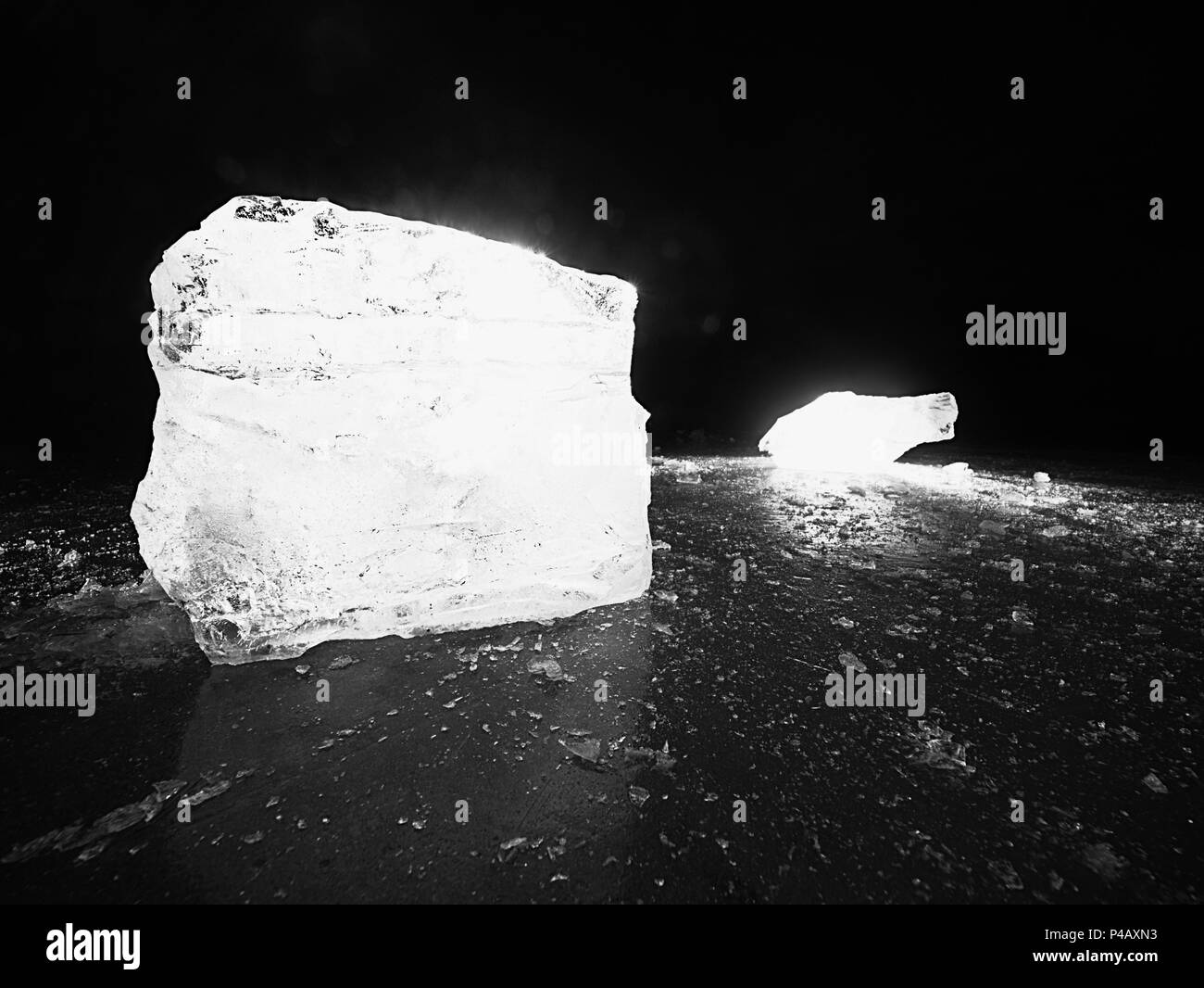 Icebergs and ice floes reflected evening light, Flat icy level in the ...