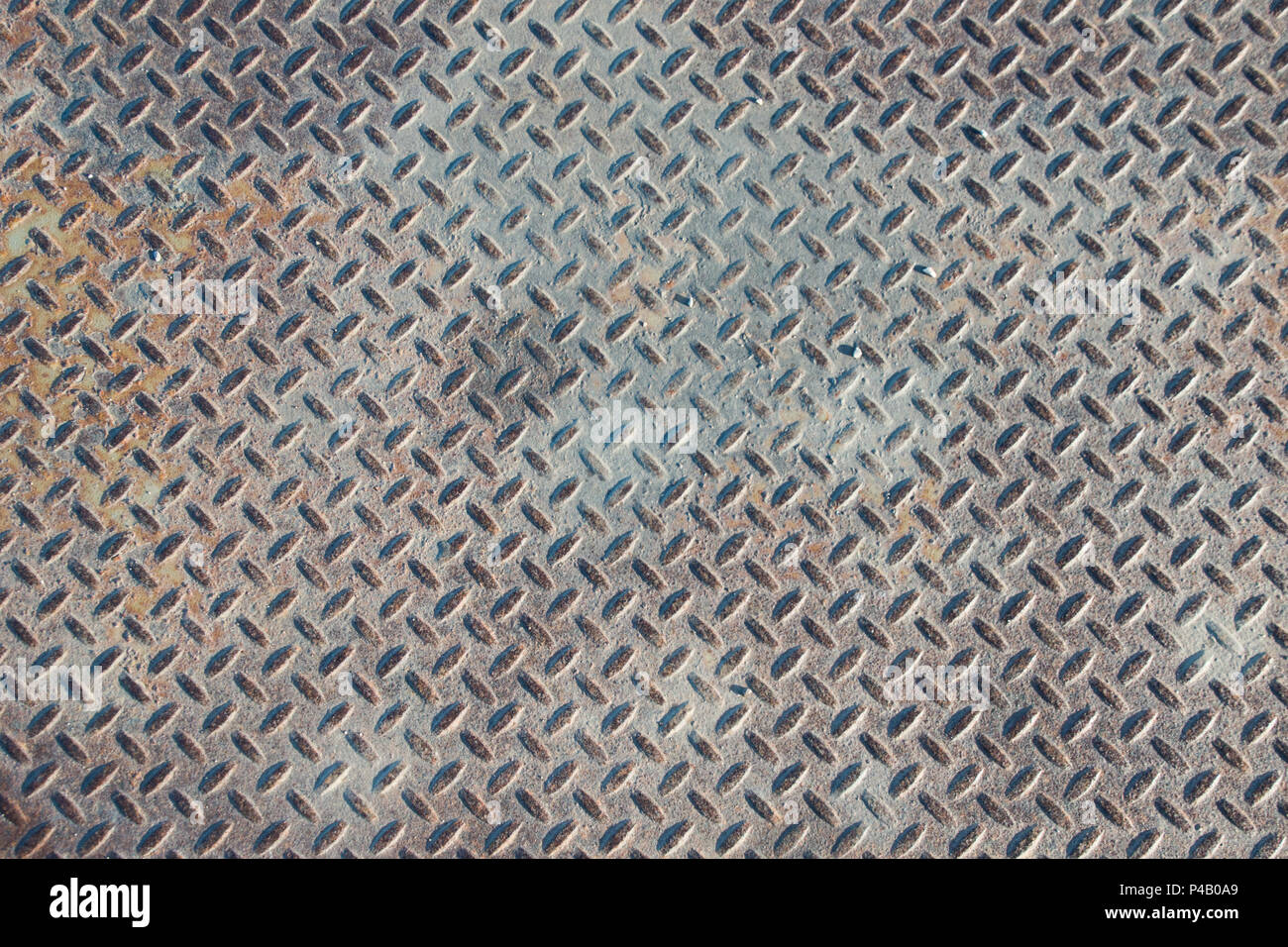 Closeup landscape of a distressed, mottled, gungy industrial ...