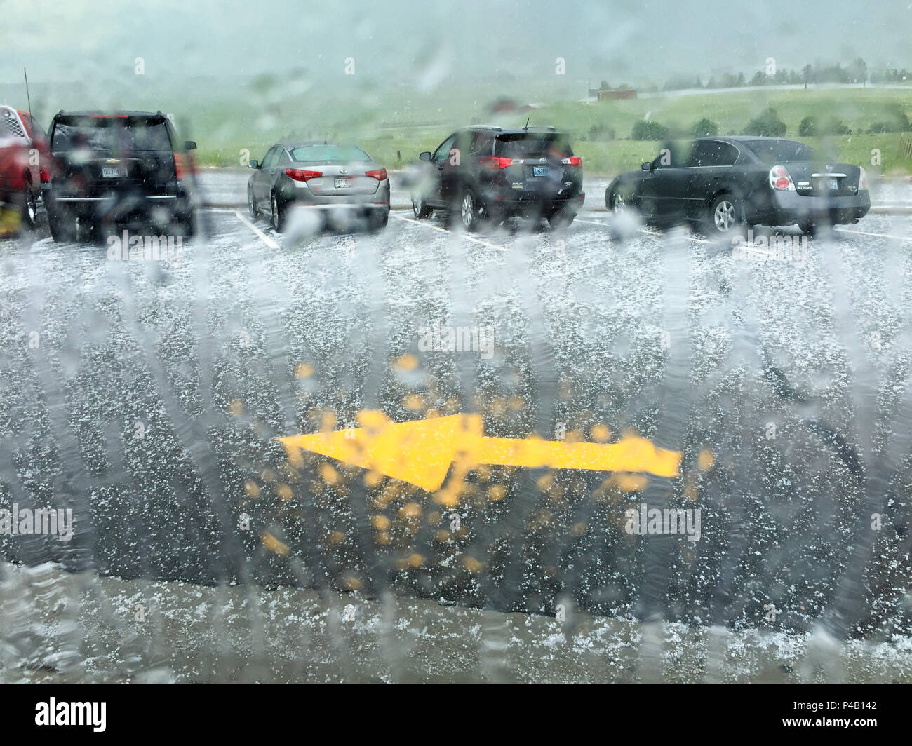 Hail and summer rain storm hits fast food parking lot, Miles City ...