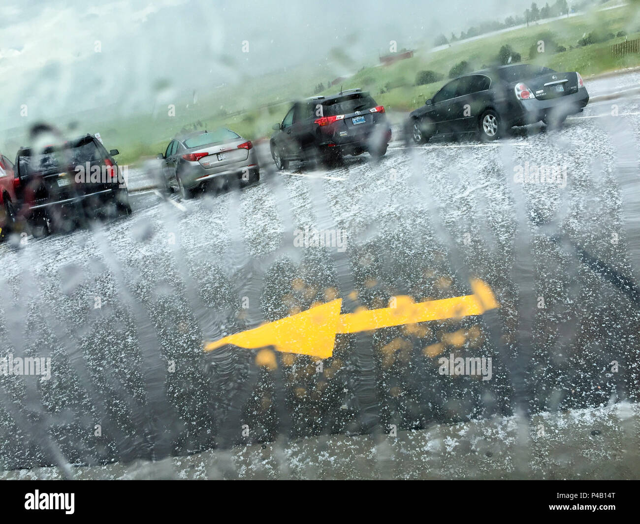 Hail and summer rain storm hits fast food parking lot, Miles City ...