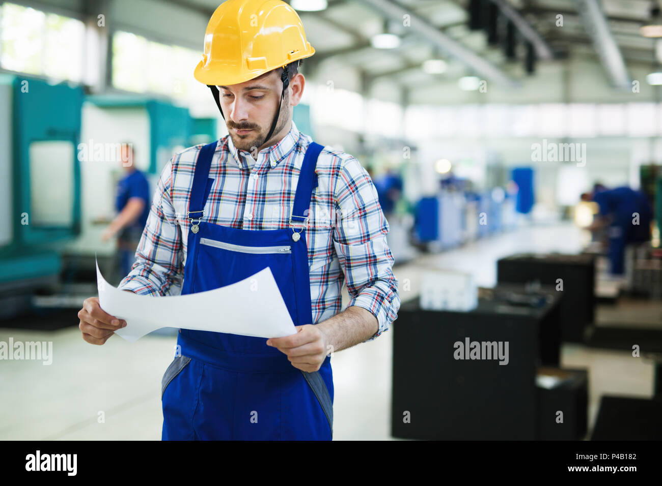 industrial factory employee working in metal manufacturing industry ...