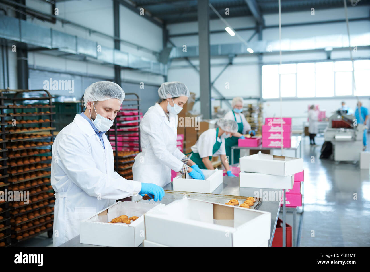 Employees packing hi-res stock photography and images - Alamy