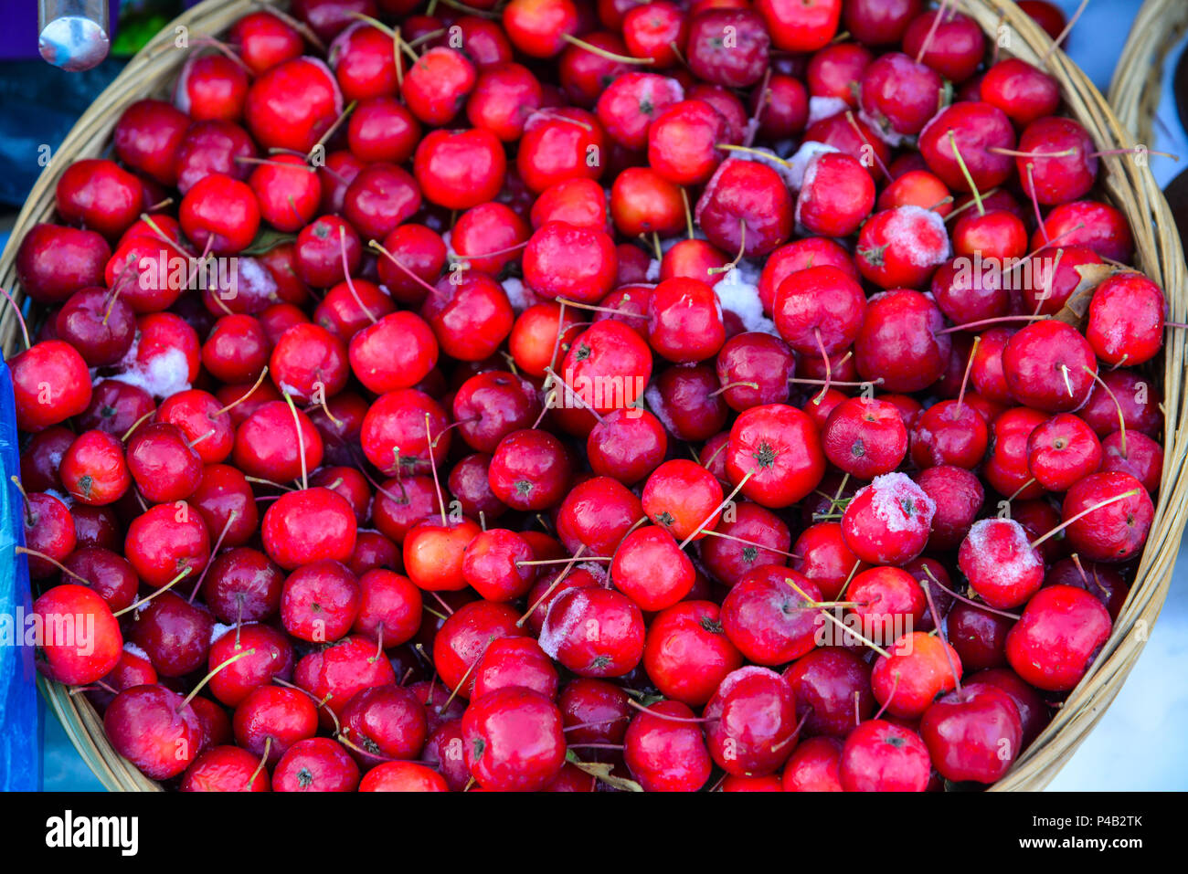 Frozen red berry fruits at local market in Harbin, China Stock Photo ...