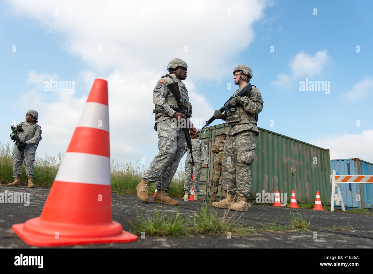 Soldiers from the 39th Signal Battalion conduct a Traffic Control Point ...