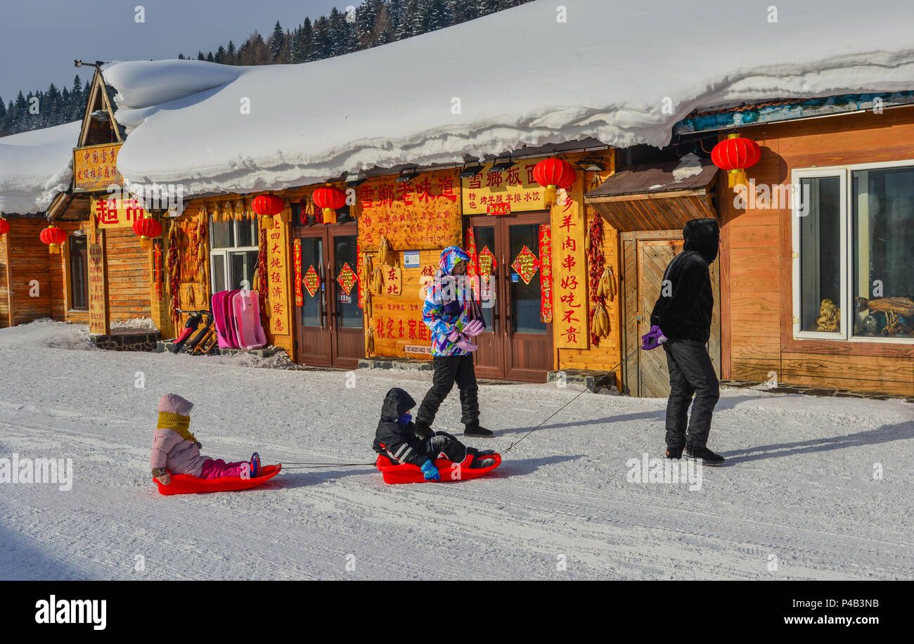 Harbin, China - Feb 24, 2018. People walking on main street of mountain ...