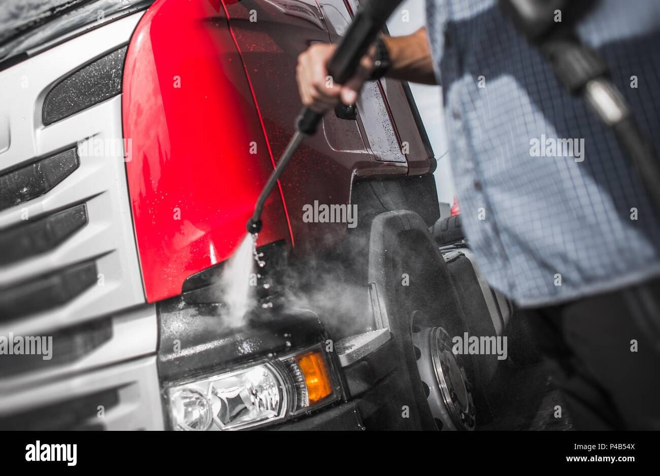 Trucker Washing His Semi Truck Using High Pressured Water Jet Cleaner ...