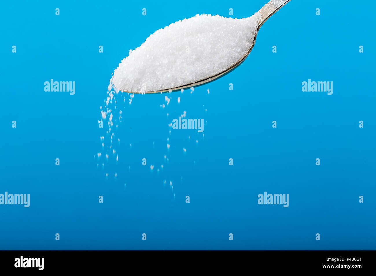 Pouring sugar on a pile of sugar Stock Photo - Alamy