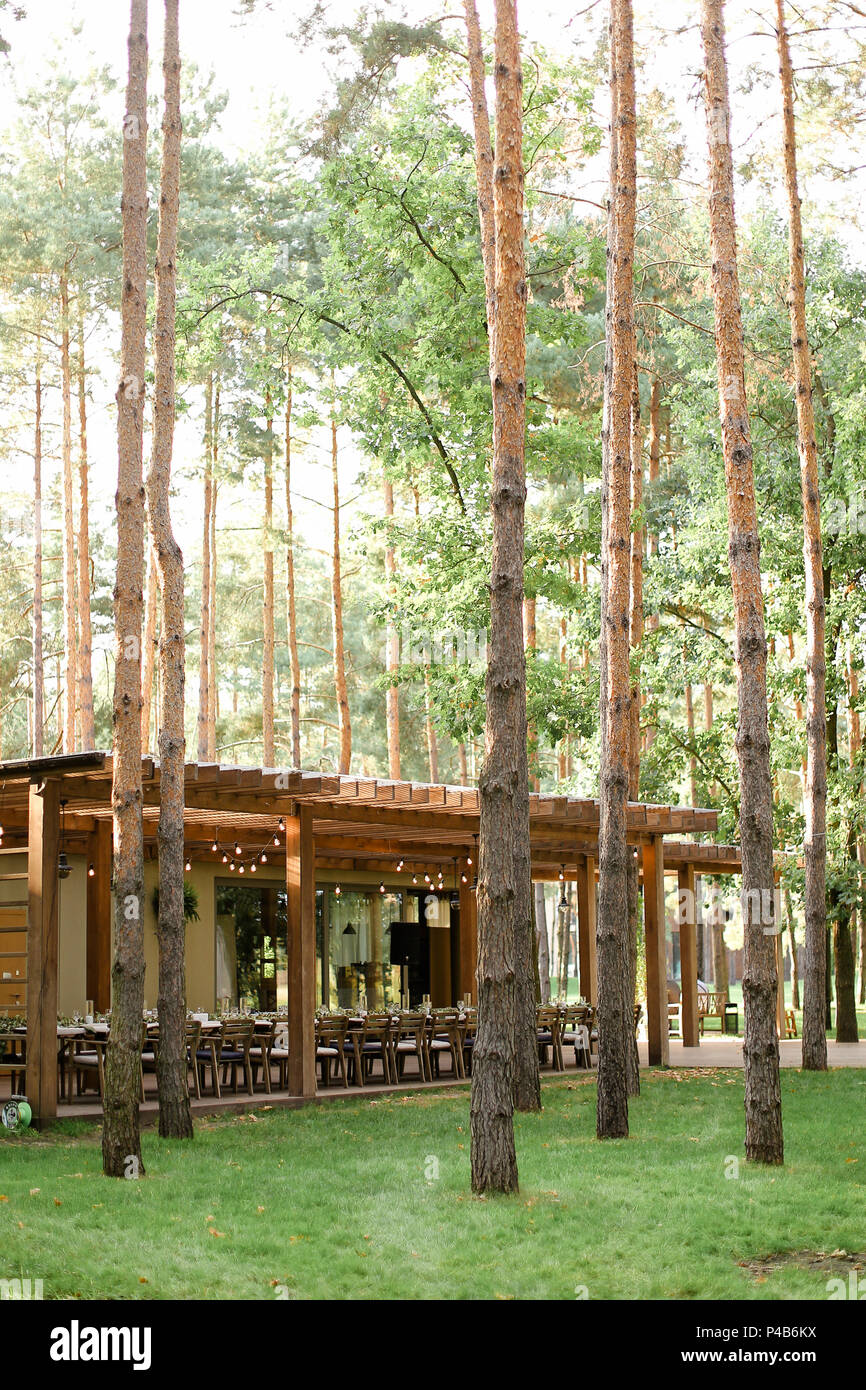 Wooden restaurant in forest Stock Photo - Alamy