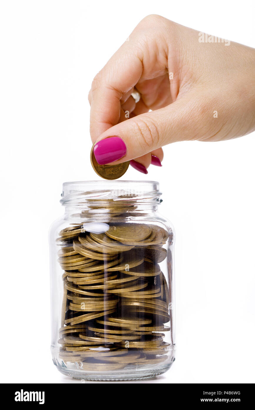 Woman putting coins donation jar hi-res stock photography and images ...