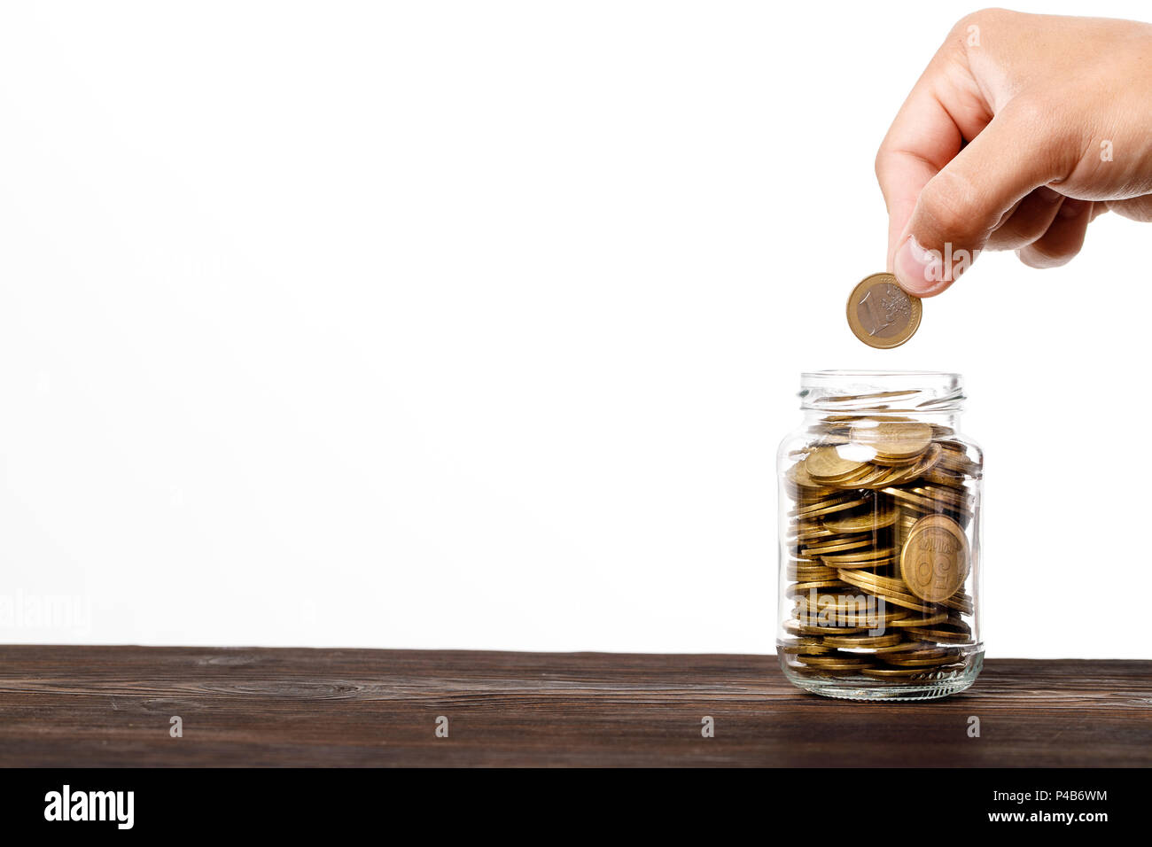 Hand businessman put coins hi-res stock photography and images - Alamy