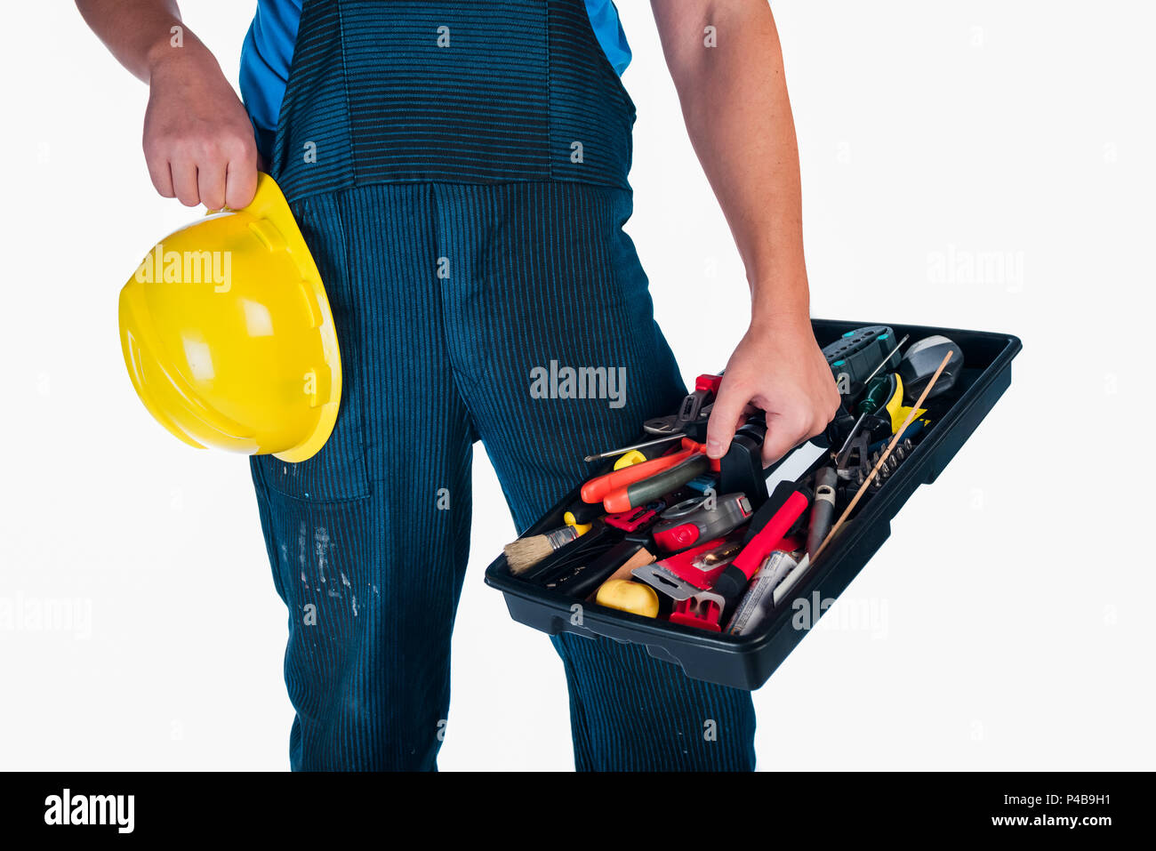 Handyman standing isolated on white in studio Stock Photo - Alamy