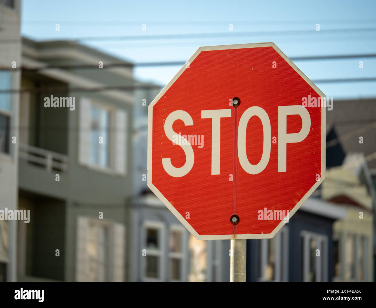 A stop sign in a residential neighborhood with copy space to the left ...