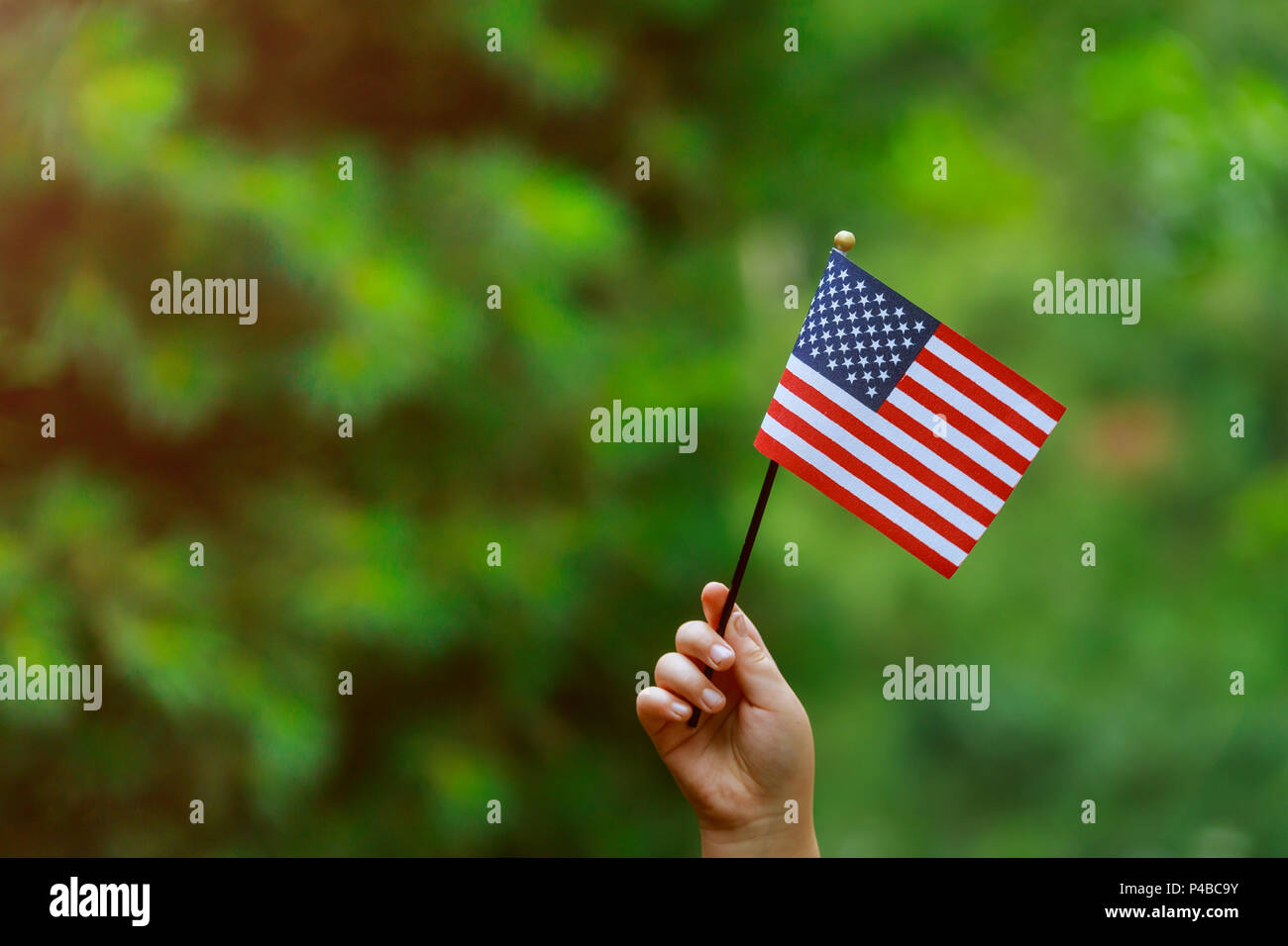 with american flag in her hand Independence Day, Flag Day concept Stock ...