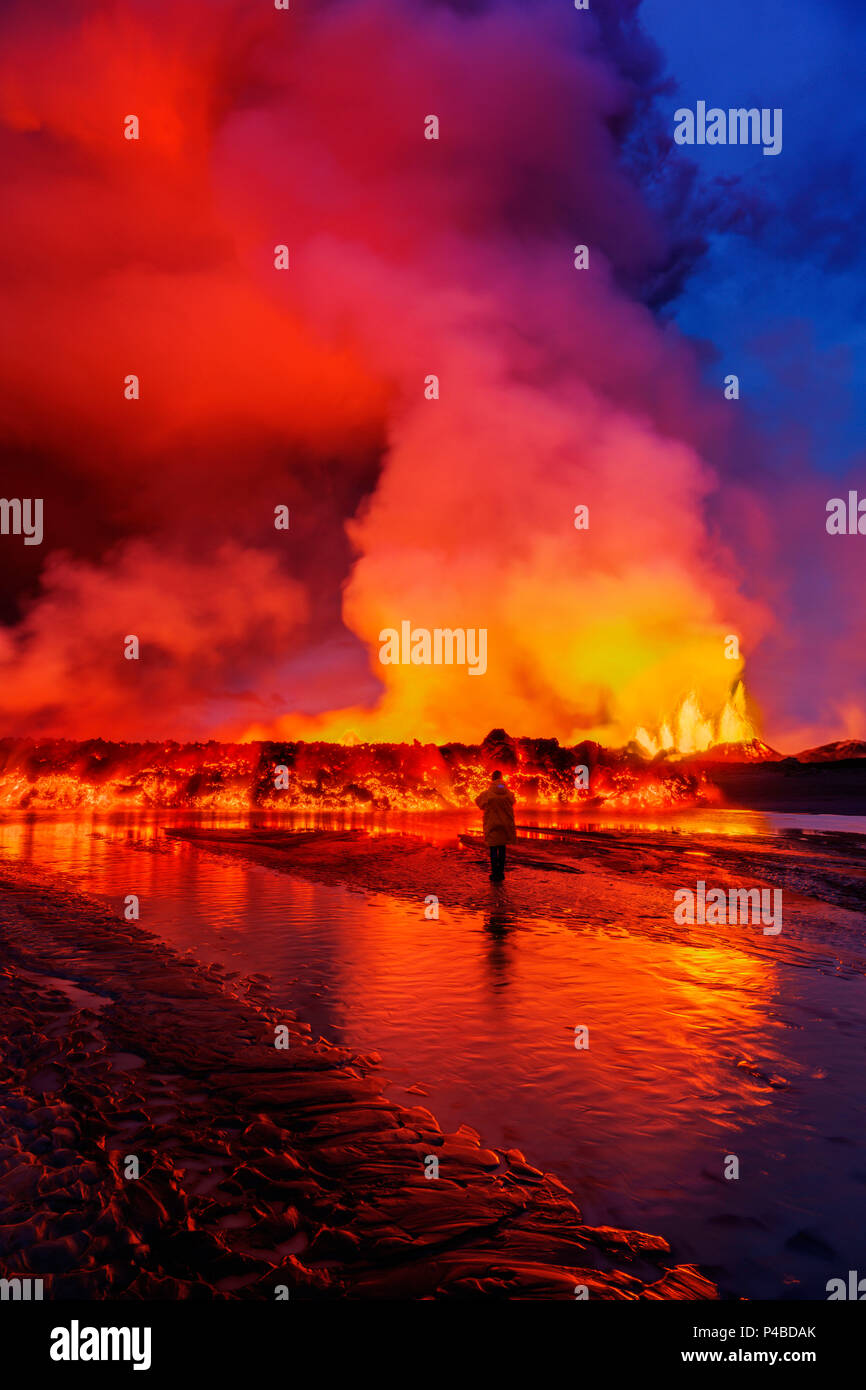 Woman watching lava flow hi-res stock photography and images - Alamy