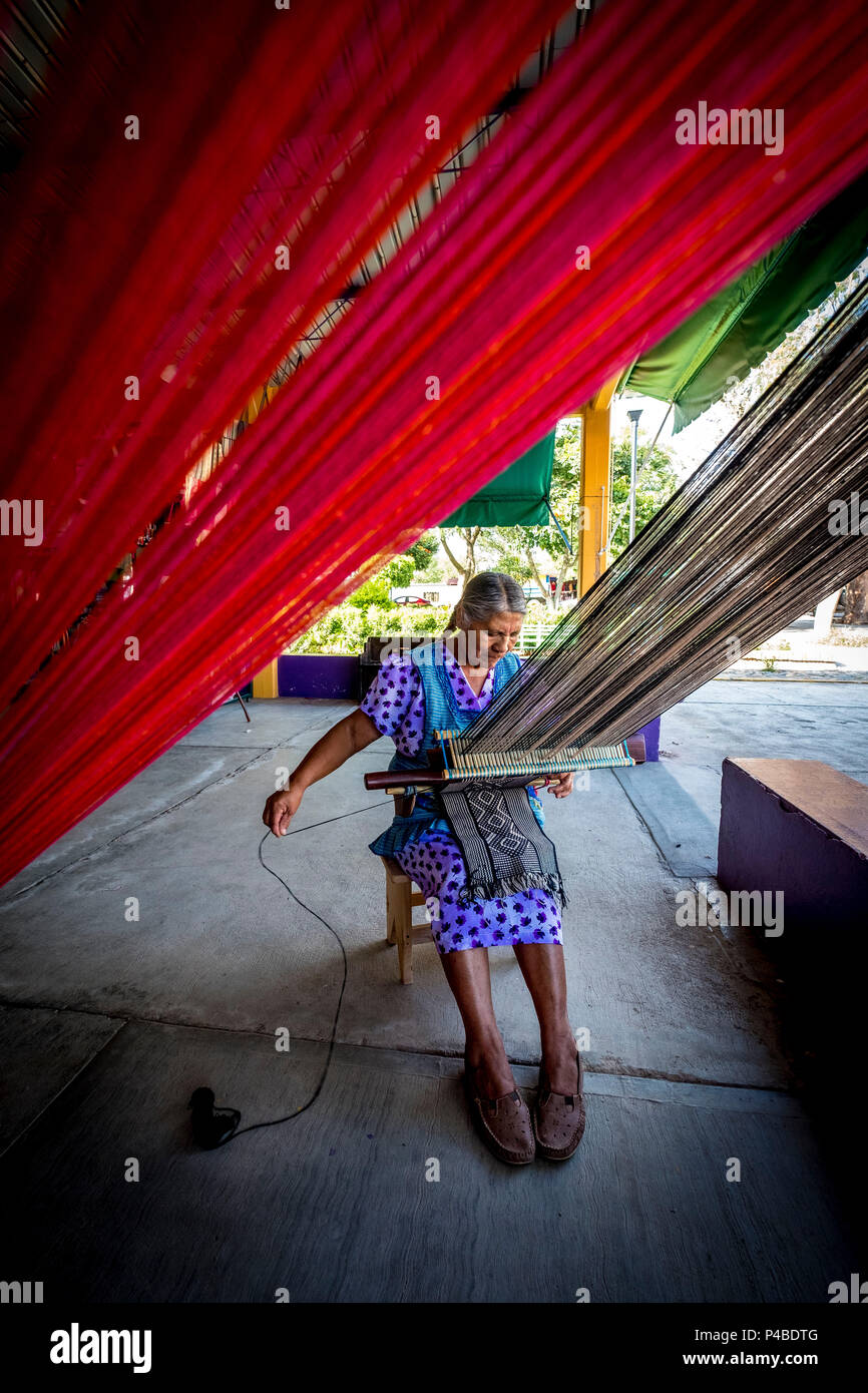 Indigenous women working handcrafted yarn in the state of Oaxaca in ...
