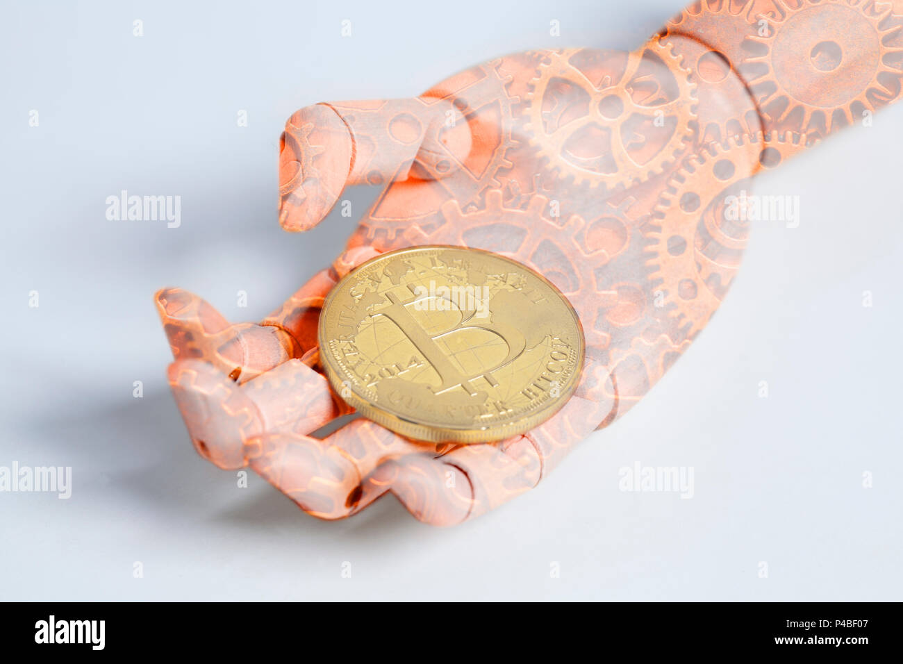Wooden gears robot hand holding bitcoin on a white background Stock ...