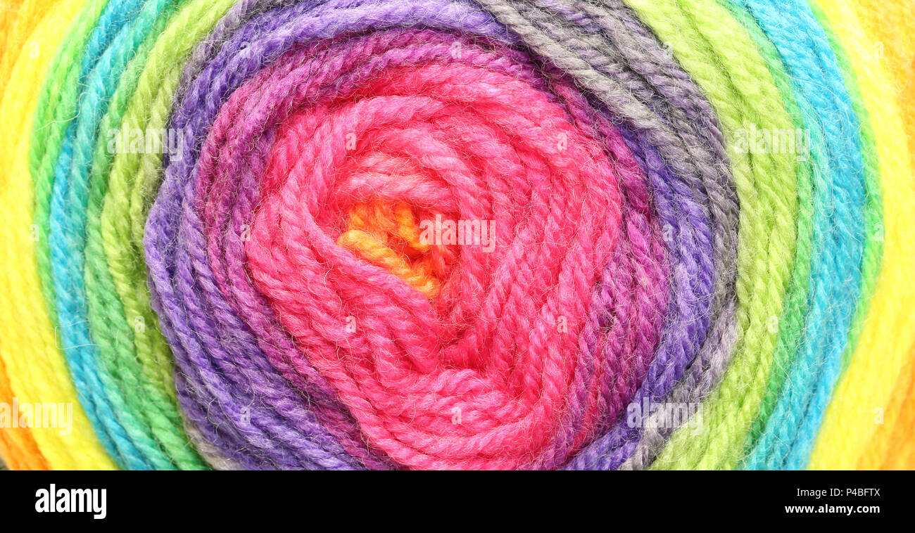 long coiled spiral of colored wool string Stock Photo - Alamy