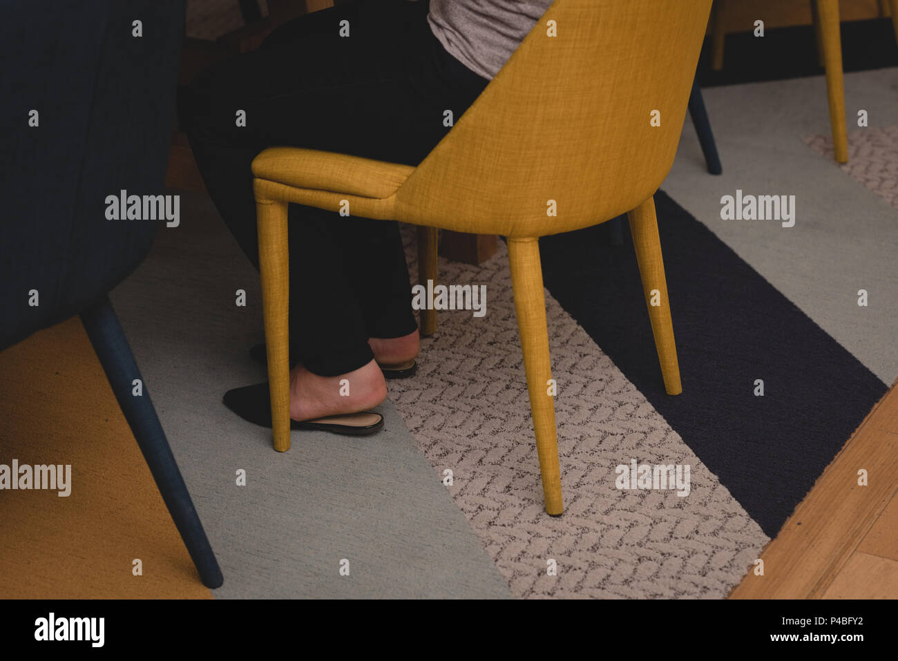 Executive sitting on chair in the creative office Stock Photo - Alamy