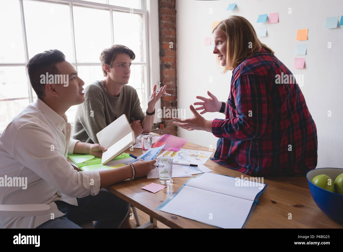 Team young professionals having conference hi-res stock photography and ...
