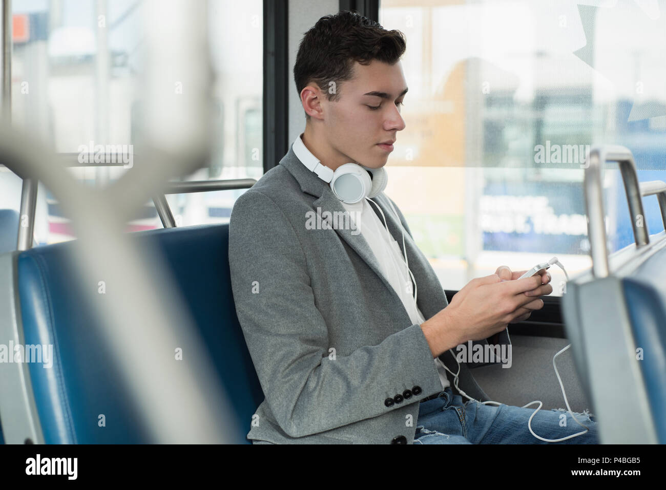 Boy smartphone bus hi-res stock photography and images - Alamy