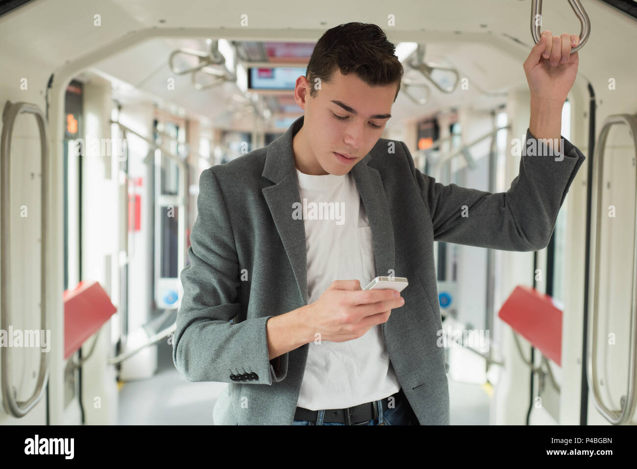 Boy smartphone bus hi-res stock photography and images - Alamy