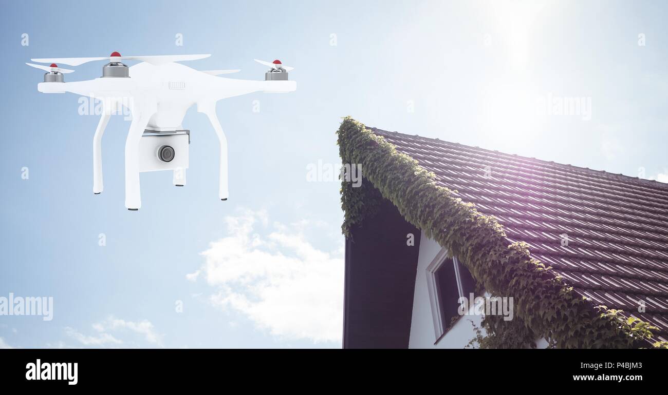 Drone flying by house with camera Stock Photo - Alamy