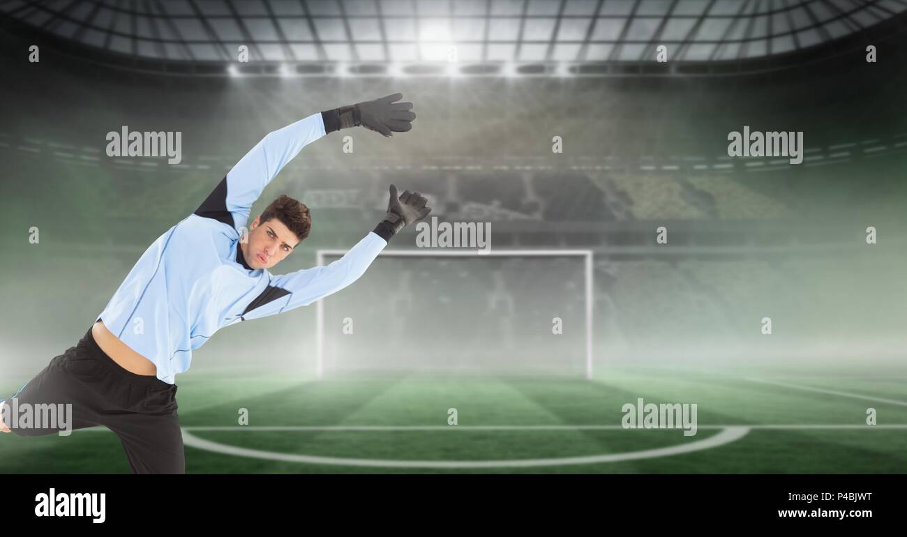 Soccer goalkeeper jumping with goal Stock Photo - Alamy