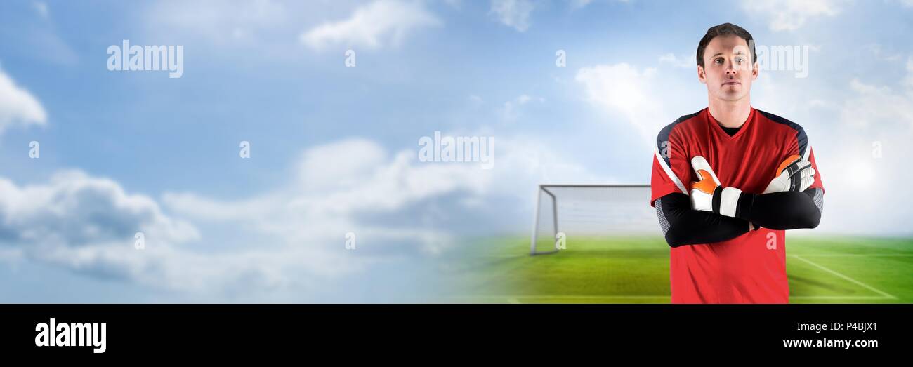 Soccer goalkeeper folding arms in goal with transition Stock Photo - Alamy