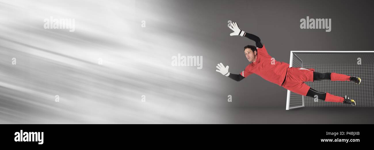Soccer goalkeeper saving in goal with transition Stock Photo - Alamy