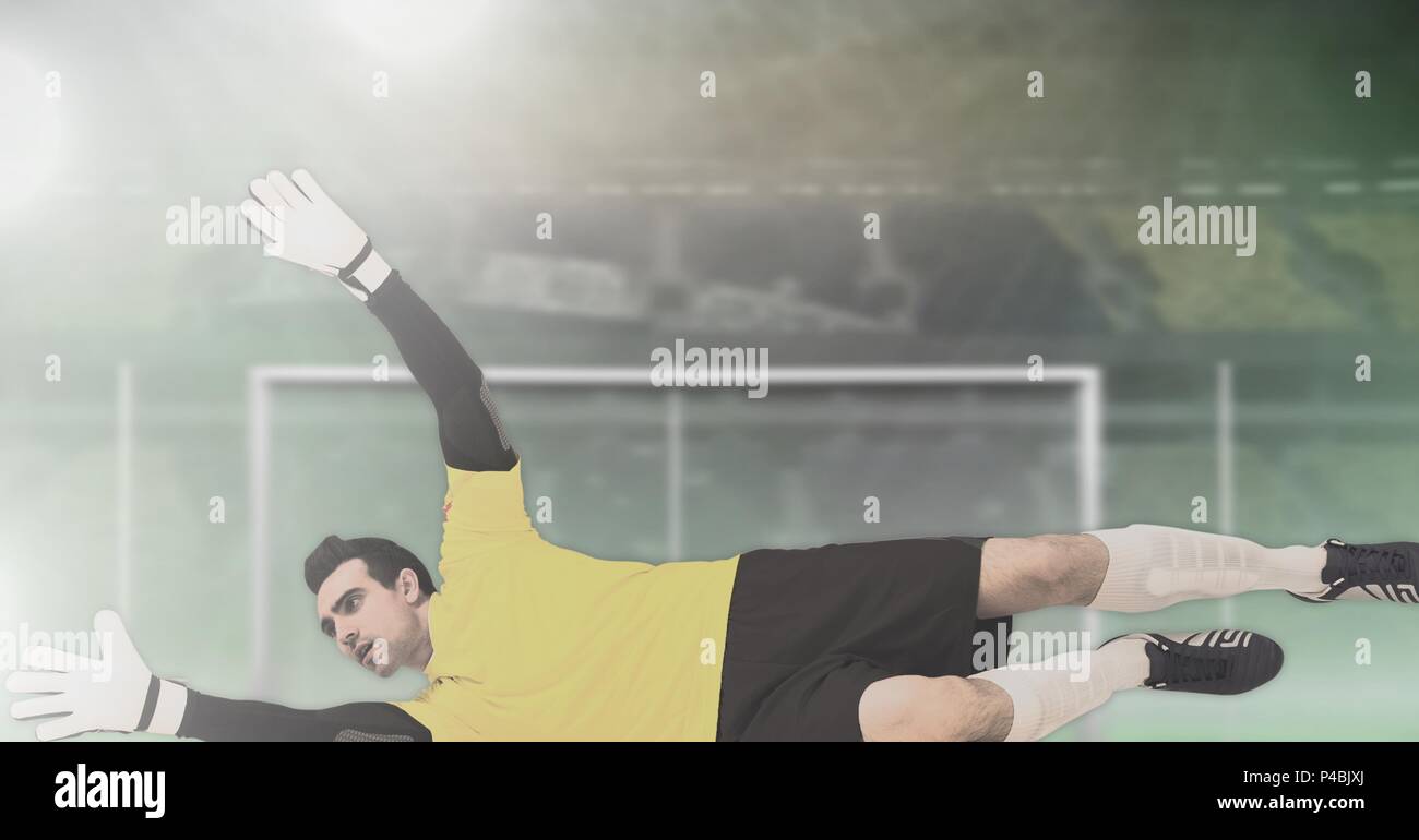 Soccer goalkeeper saving in goal Stock Photo - Alamy