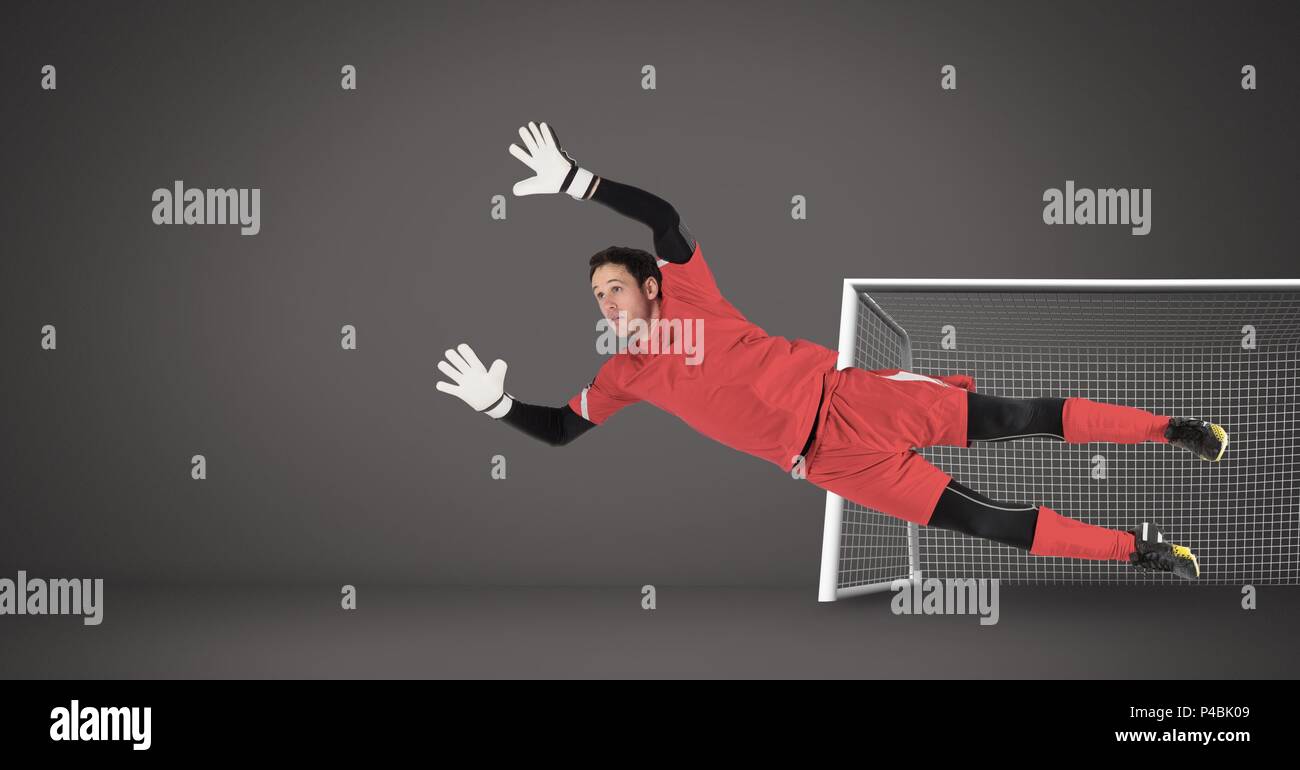 Soccer goalkeeper saving in goal Stock Photo - Alamy