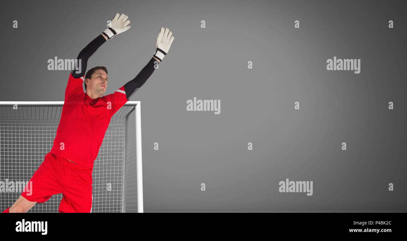 Soccer goalkeeper saving in goal Stock Photo - Alamy