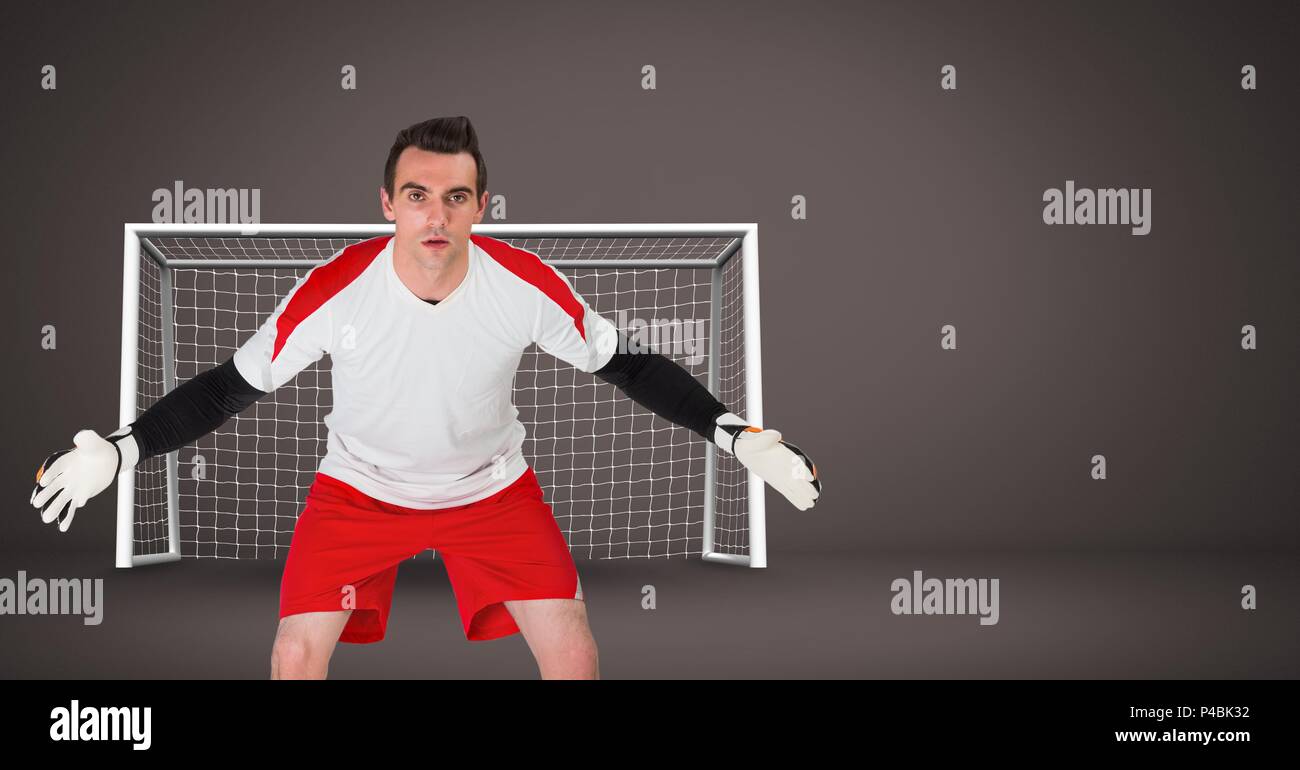 Soccer goalkeeper saving in goal Stock Photo - Alamy